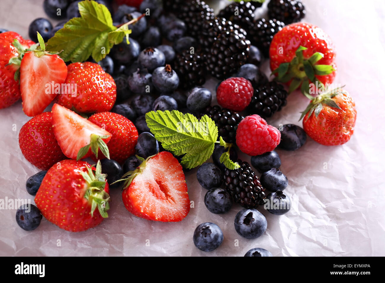 Variety of summer berries on white background Stock Photo - Alamy