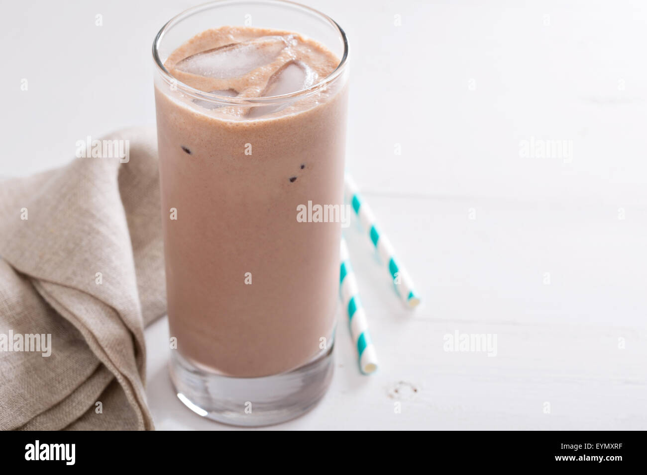 Cold chocolate milkshake in tall glass with ice Stock Photo - Alamy