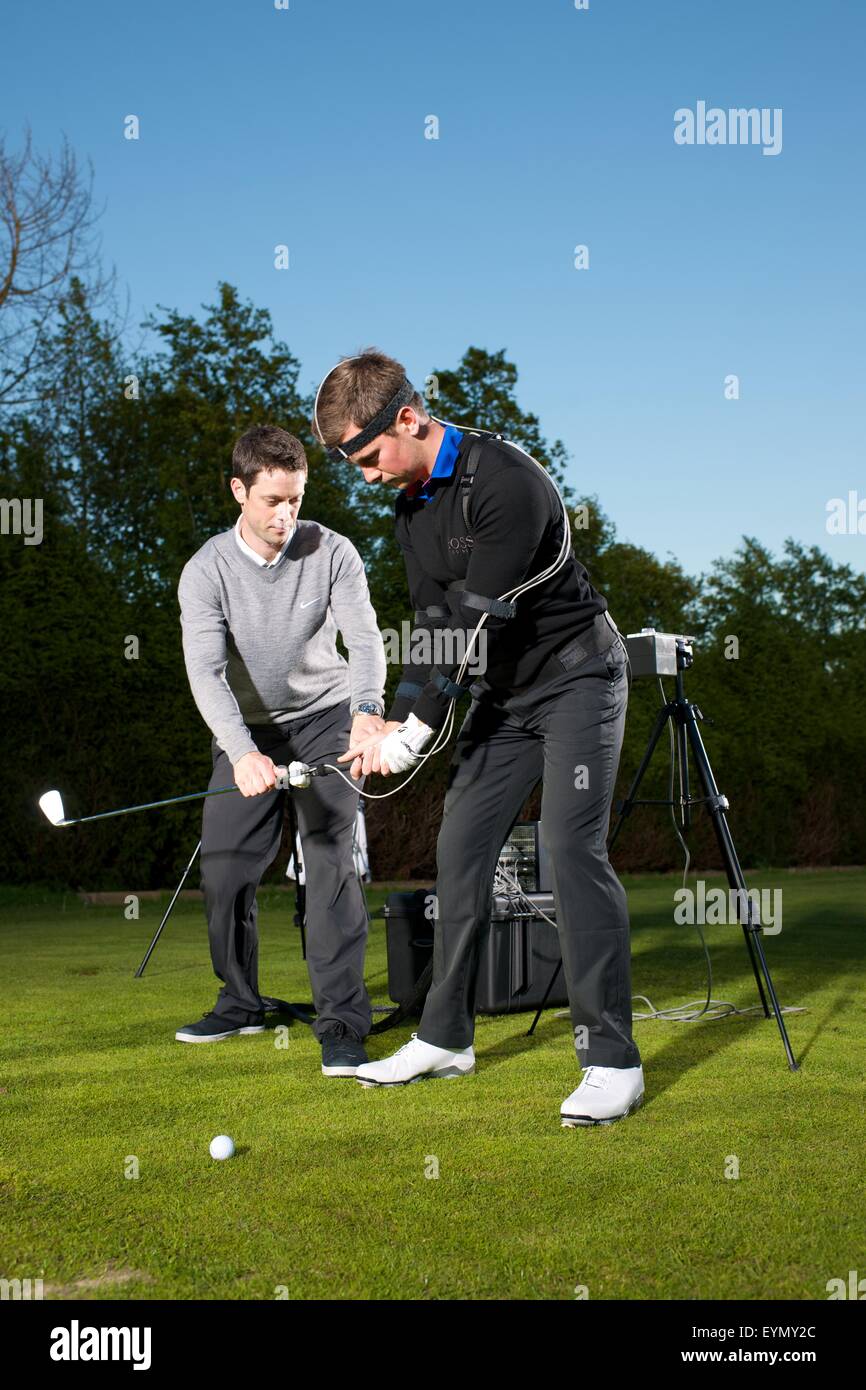 golf coach teaching during lesson Stock Photo - Alamy