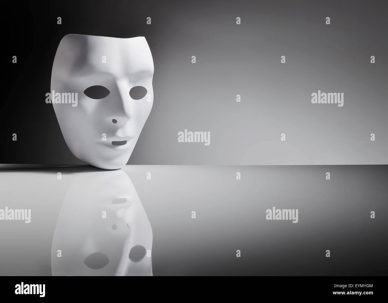 White plastic mask on reflective surface Stock Photo - Alamy