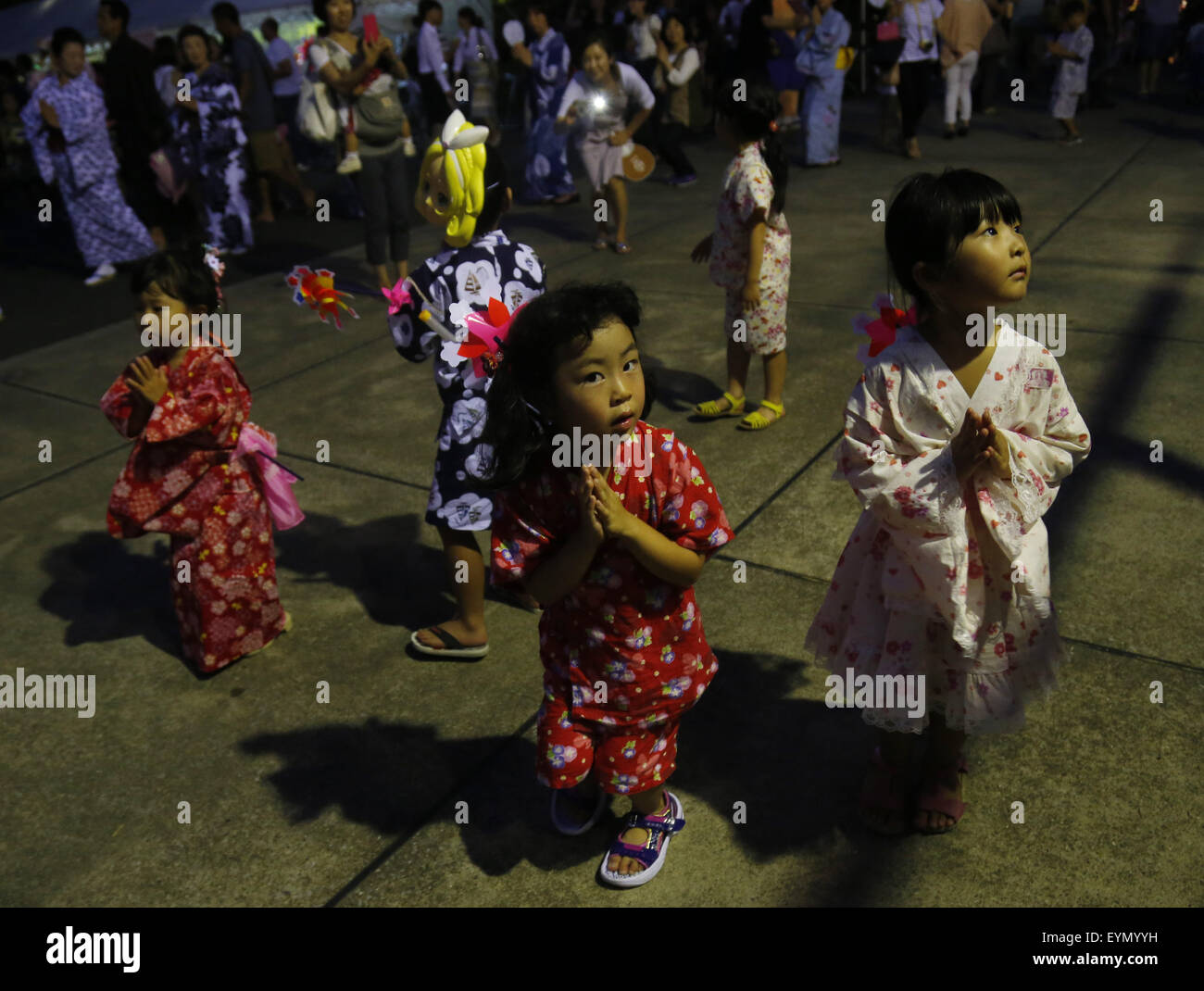Tokyo, Japan. 1st Aug, 2015. Children perform bon dance during the ...