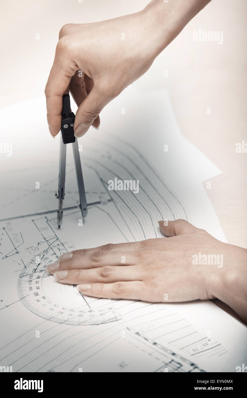 Hands of engineer working on a construction plan Stock Photo - Alamy