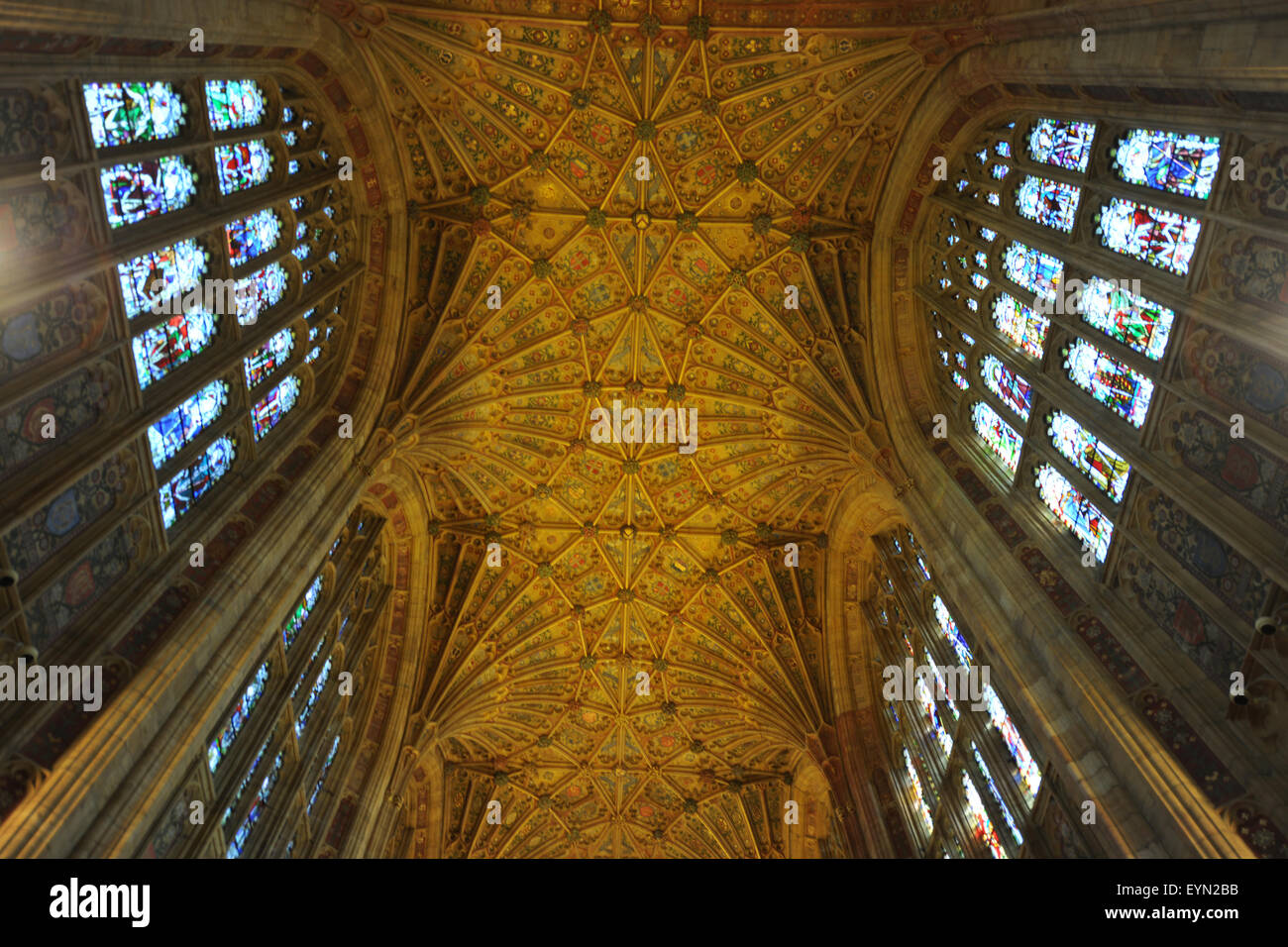Vaulted ceiling and stained glass windows in Sherborne Abbey, Dorset, a ...