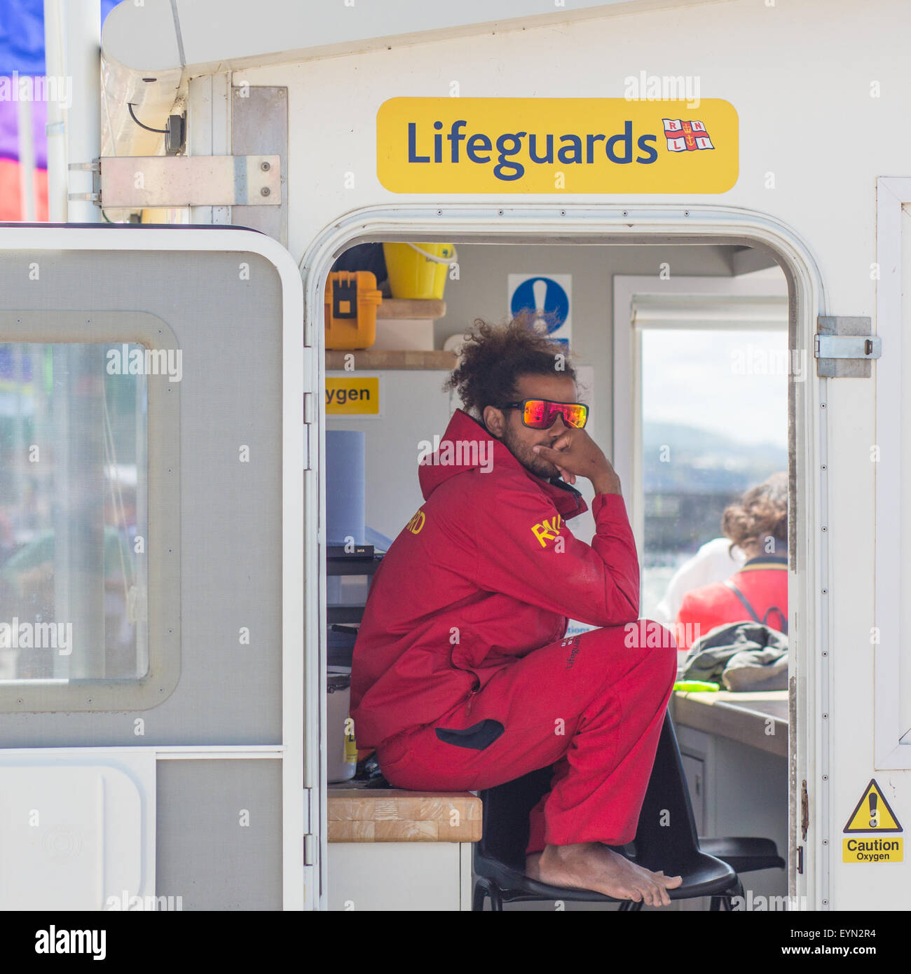 A lifeguard manning a lifeguard hut Stock Photo - Alamy