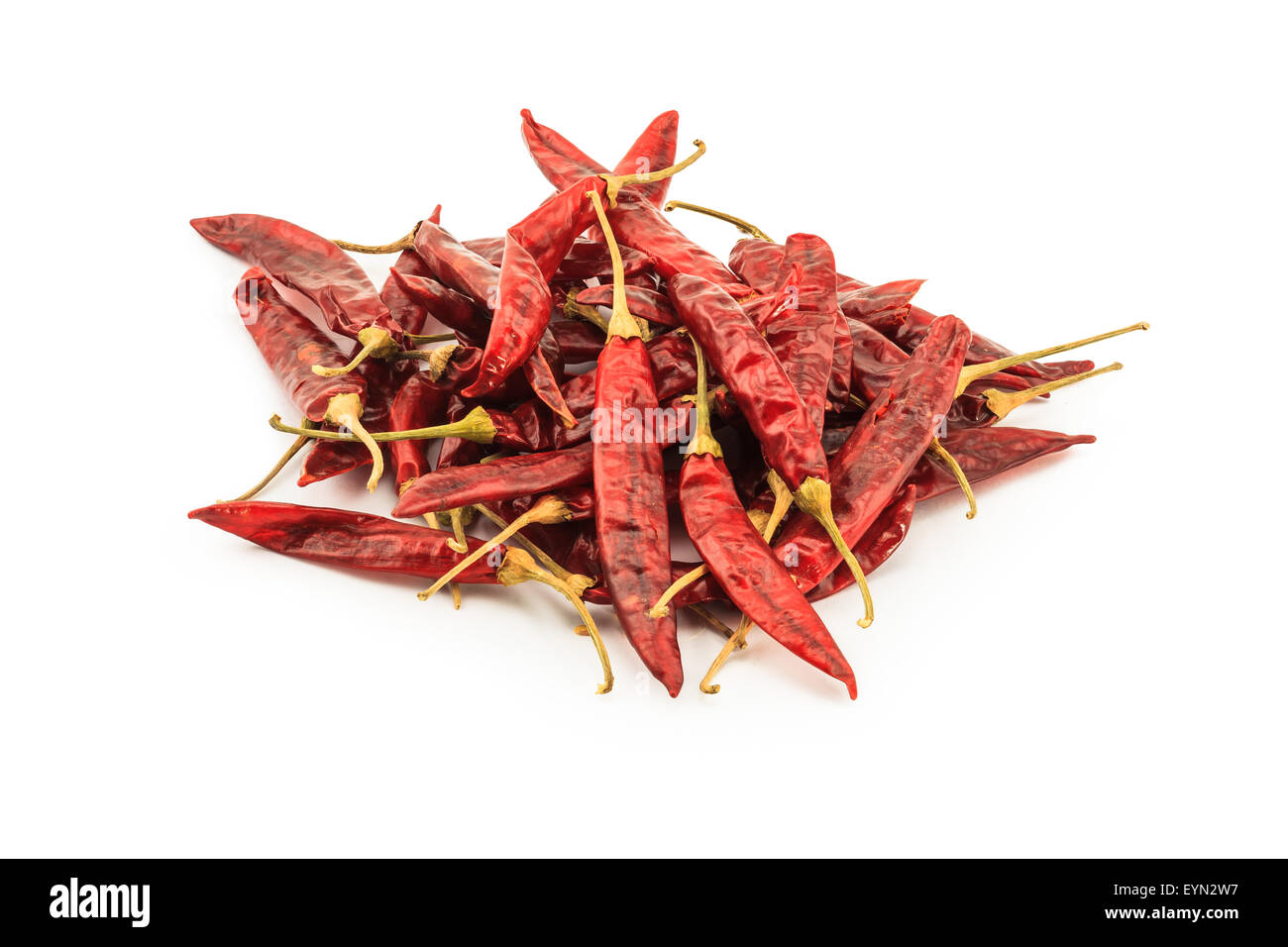 Pile of dried chilli on white background Stock Photo - Alamy