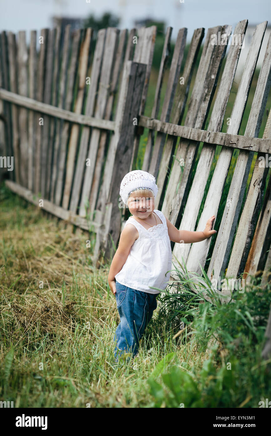 little girl and wooden fence Stock Photo - Alamy