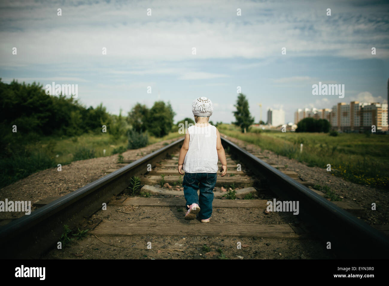 little girl plays on railroad Stock Photo - Alamy