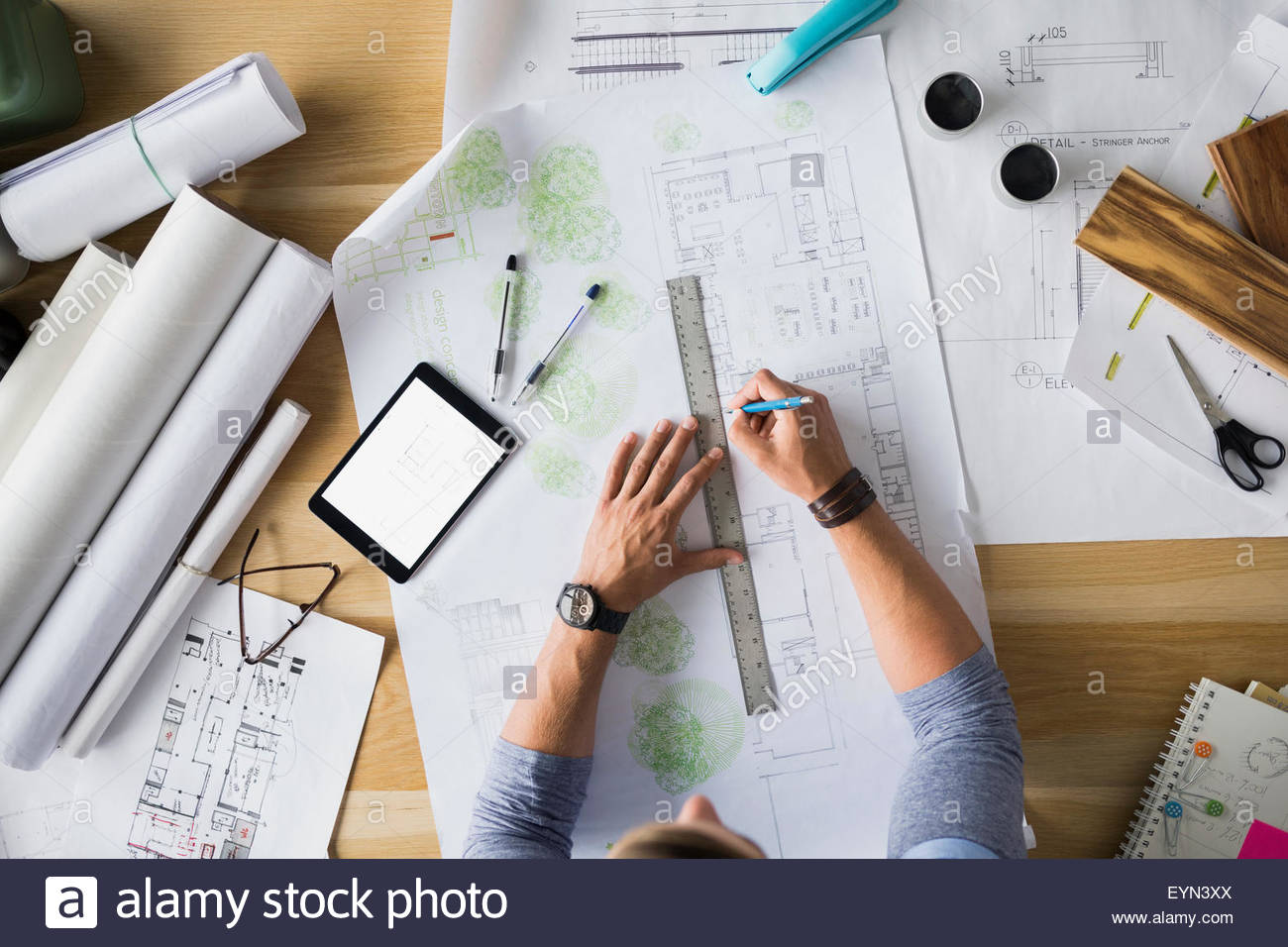 Overhead view architect drafting blueprints hi-res stock photography ...