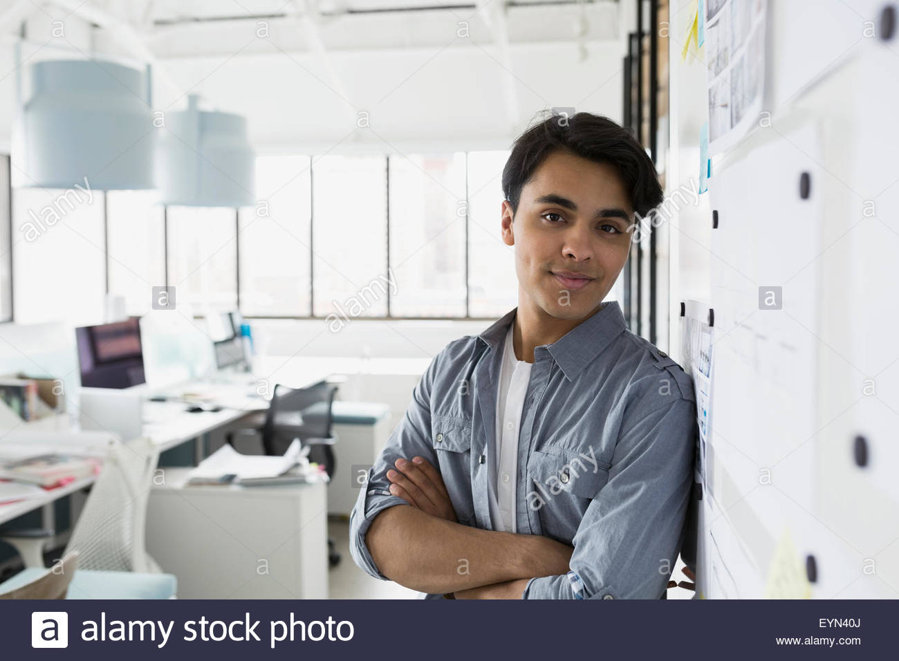 Portrait confident architect leaning on whiteboard in office Stock ...