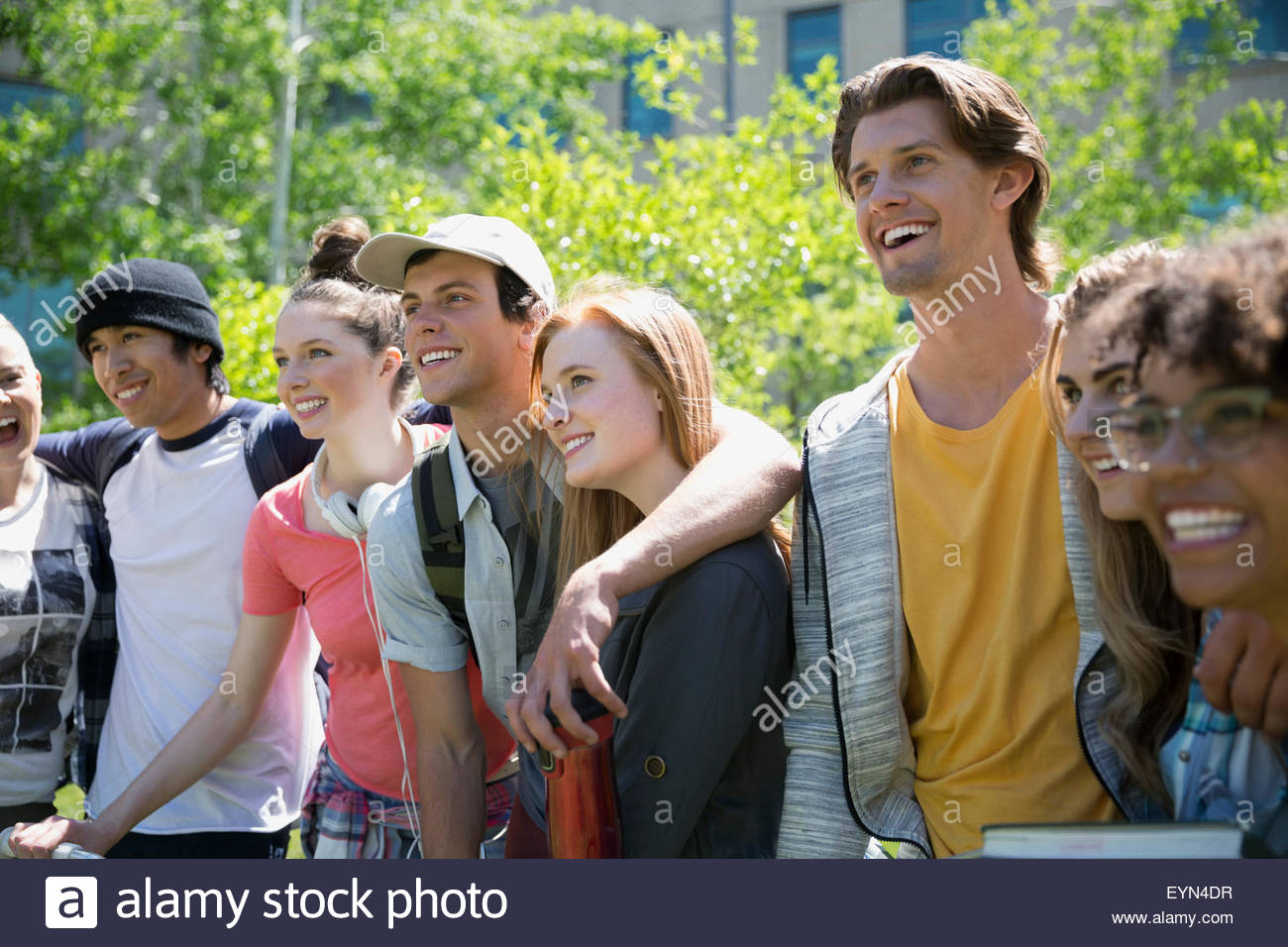 Smiling college students in a row Stock Photo - Alamy
