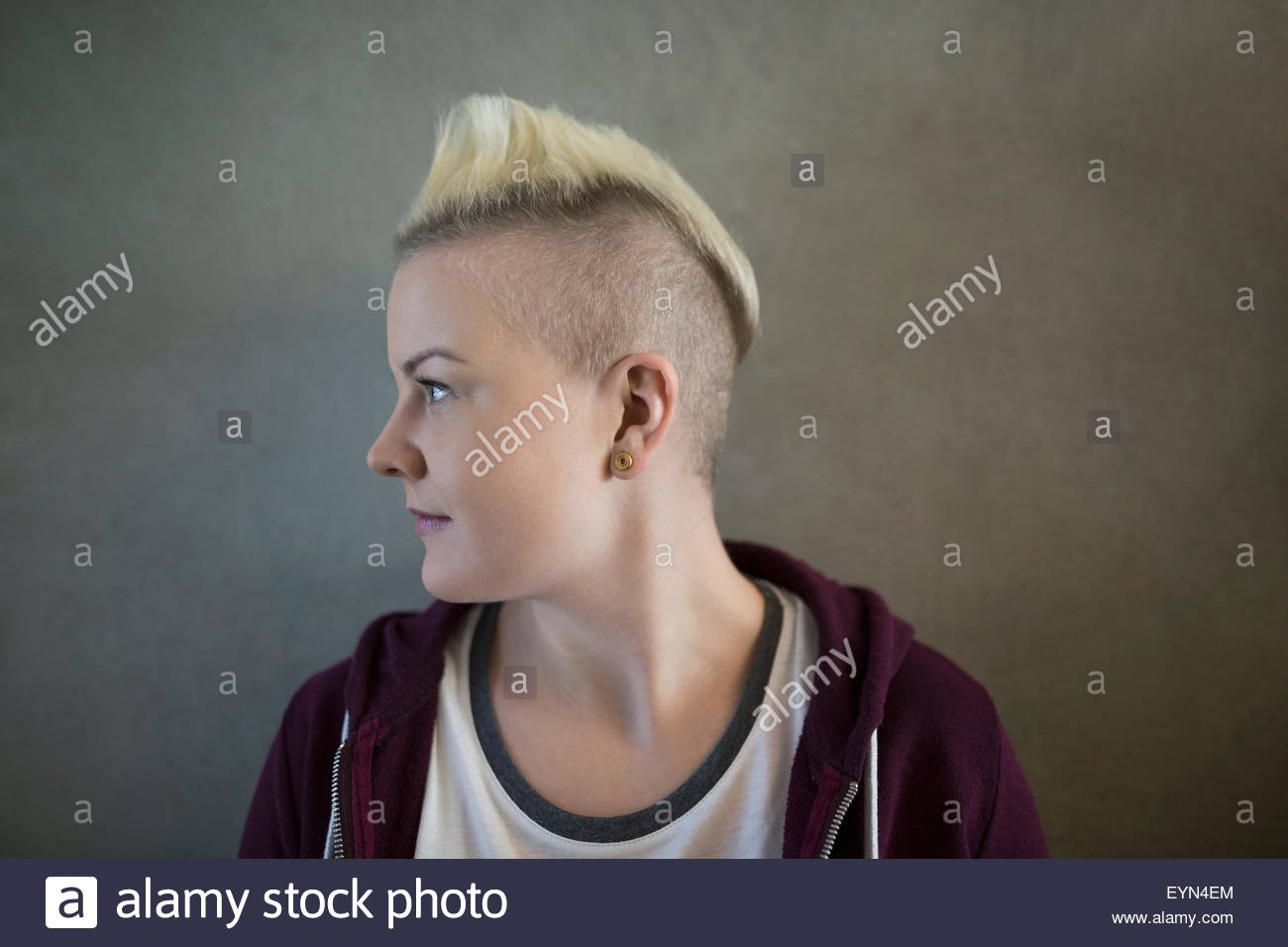 Profile portrait blonde woman with mohawk looking away Stock Photo - Alamy