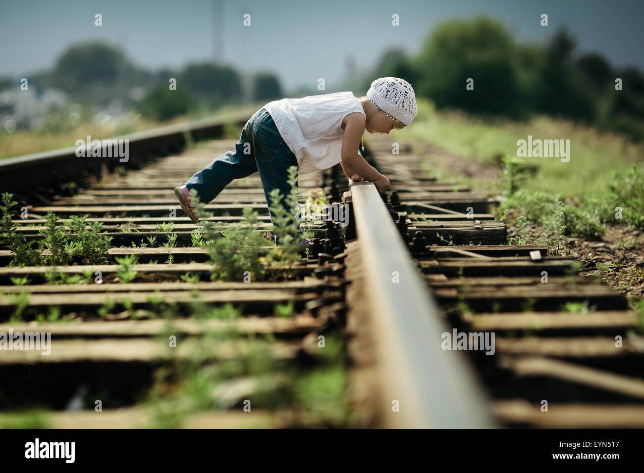 little girl plays on railroad Stock Photo - Alamy
