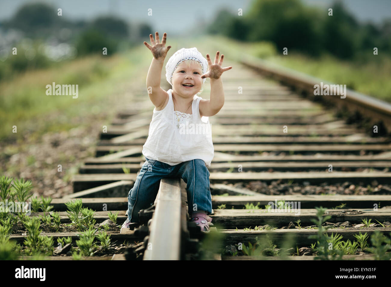 little girl plays on railroad Stock Photo - Alamy