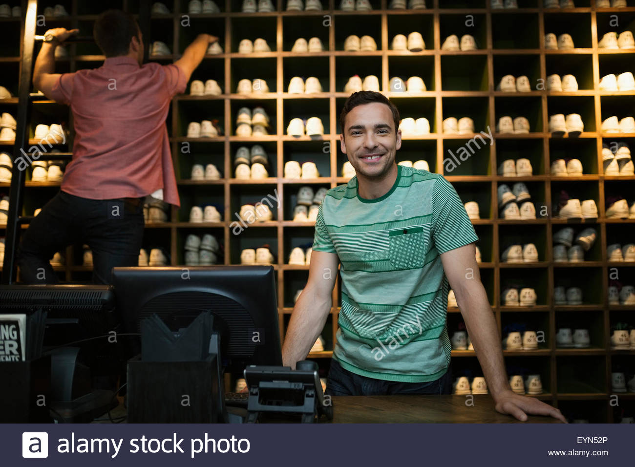 Portrait confident worker shoe rental counter bowling alley Stock Photo ...