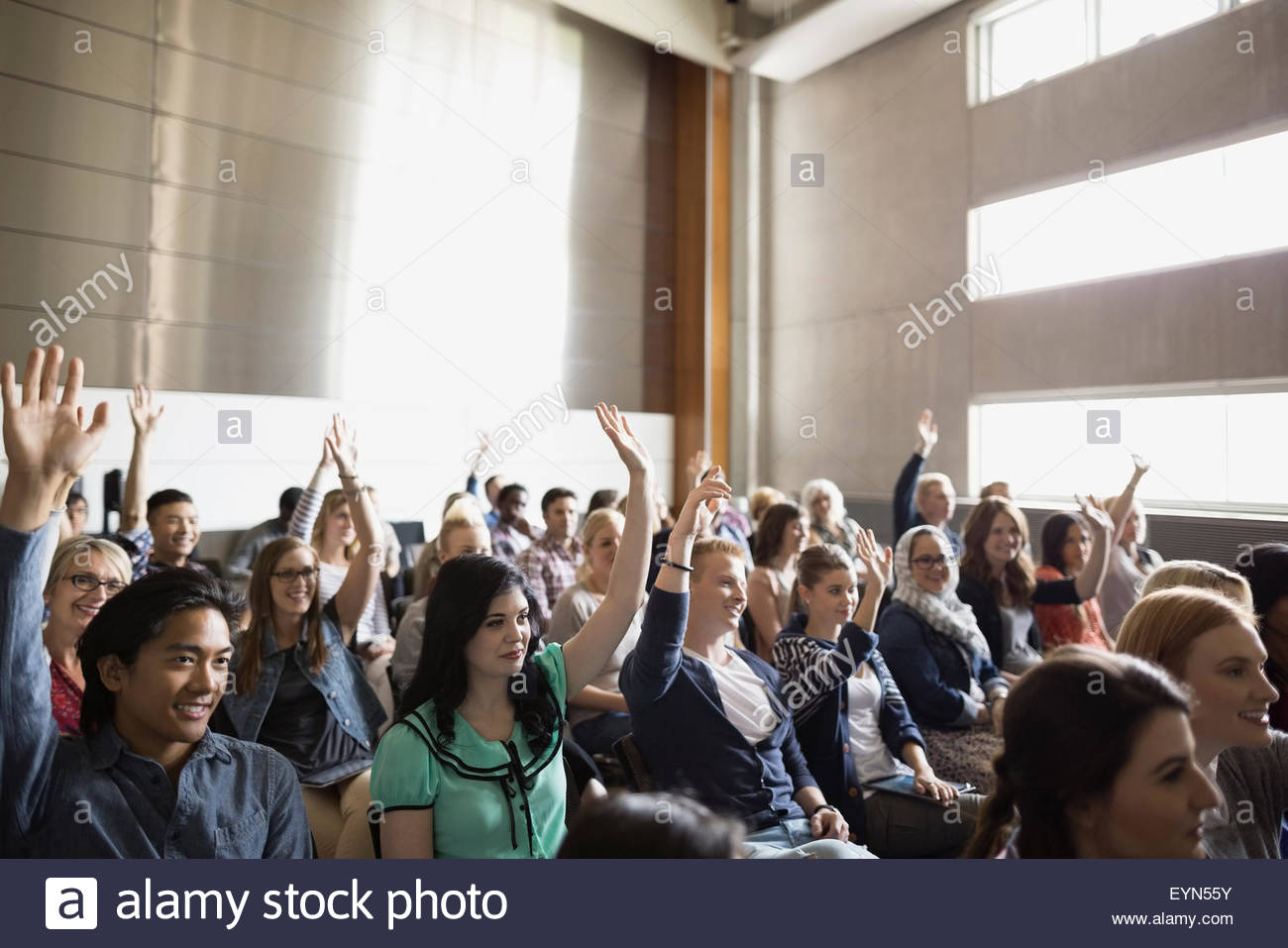Group people raising hands question hi-res stock photography and images ...