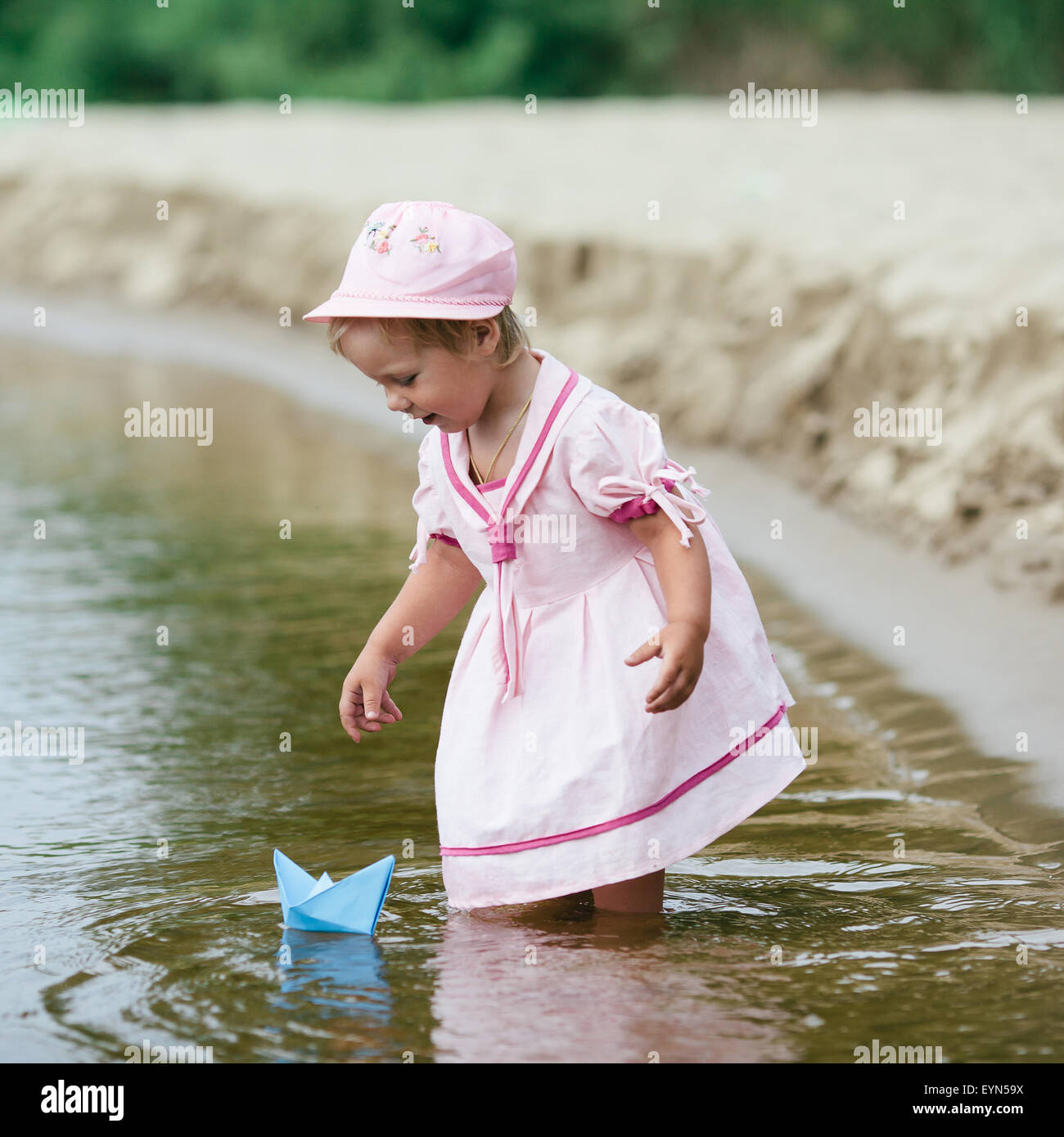 Children play colorful paper boats hi-res stock photography and images ...