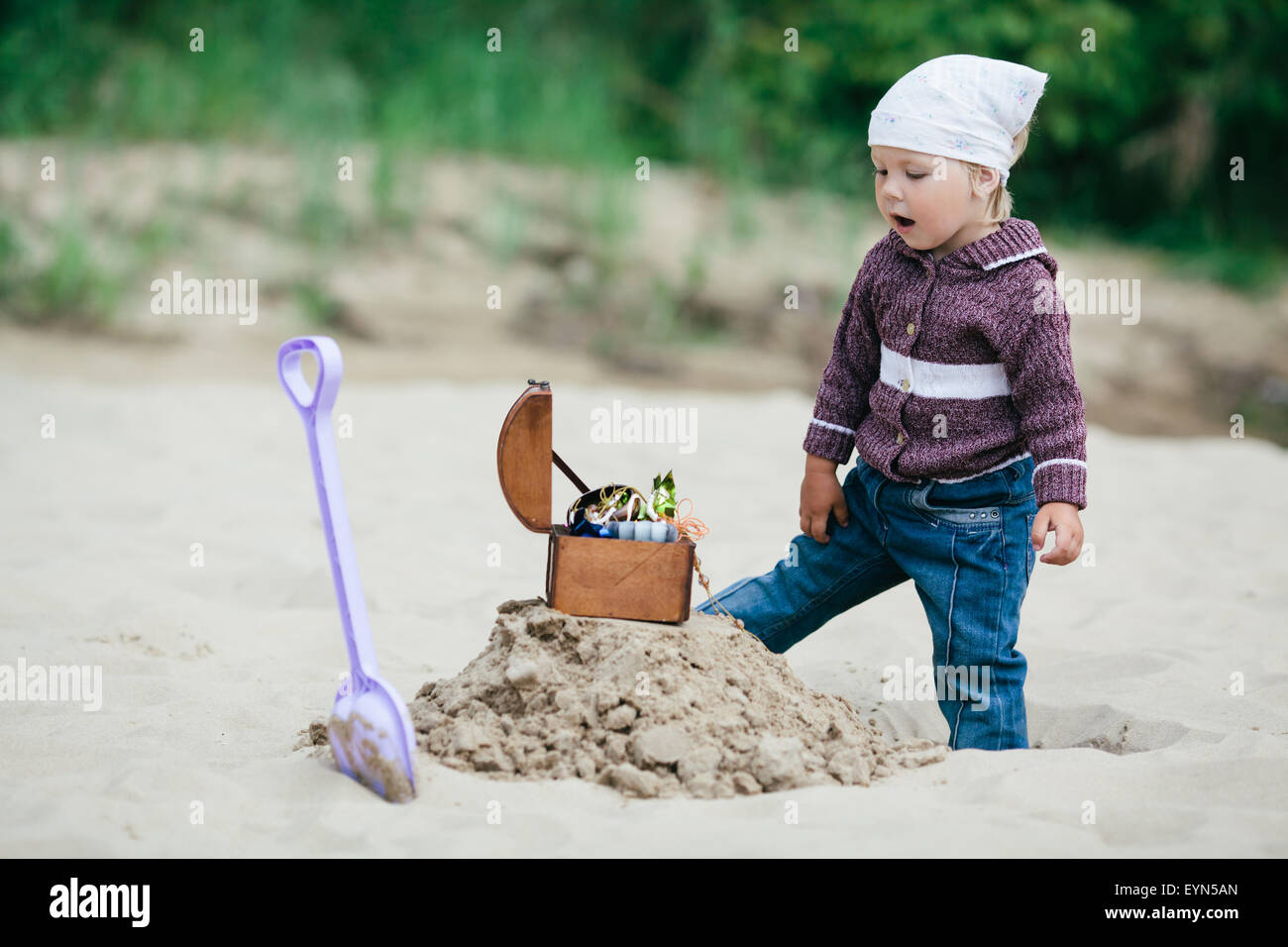 little girl hunting for treasure Stock Photo - Alamy