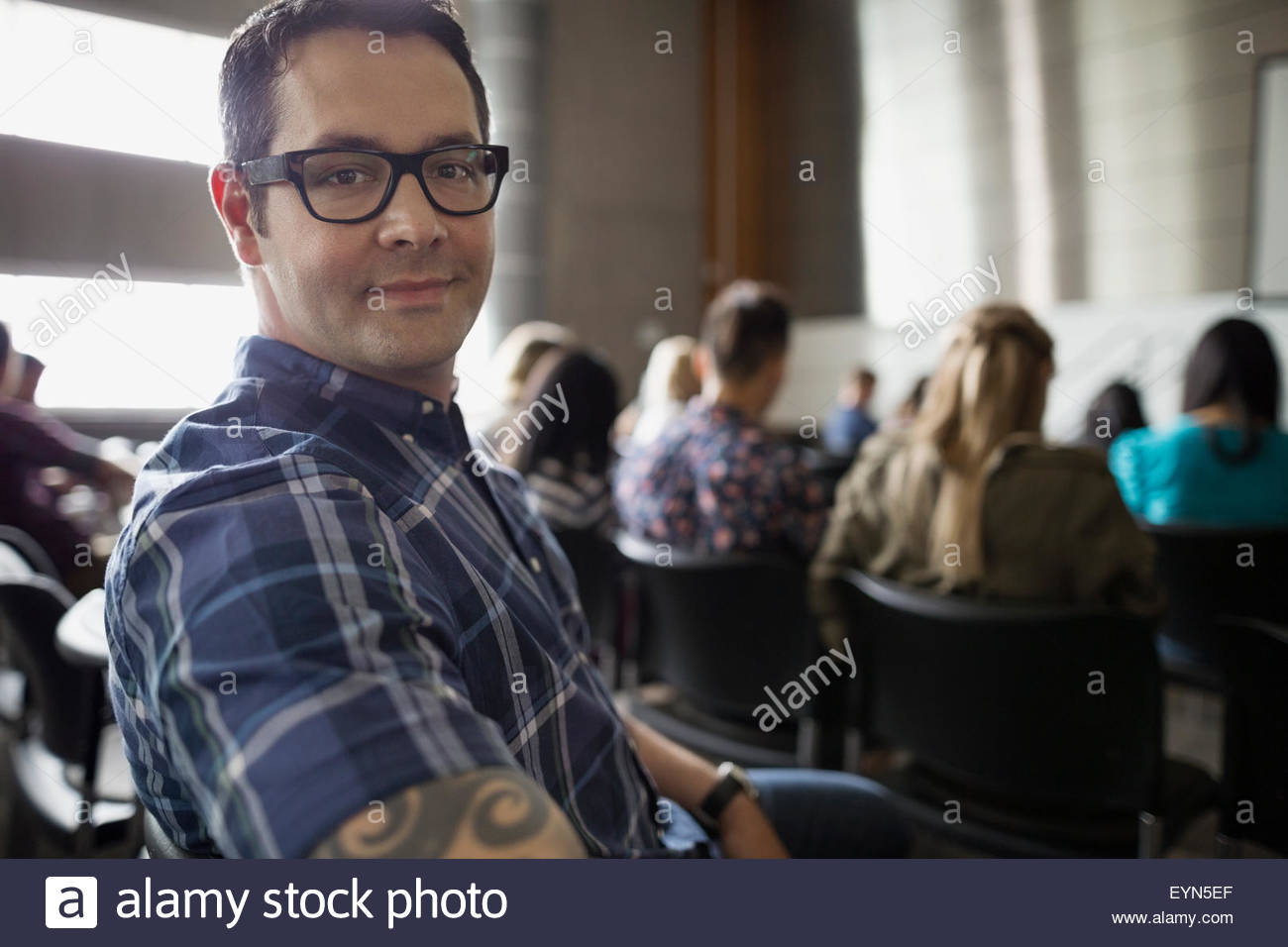Portrait confident student in auditorium audience Stock Photo - Alamy