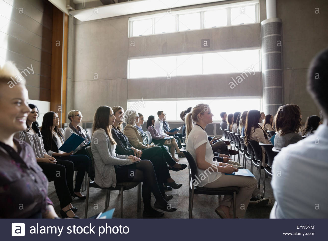 Students listening in lecture audience in auditorium Stock Photo - Alamy