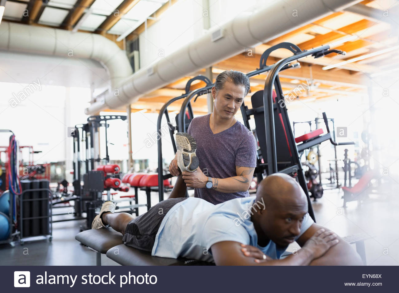 Gym exercise man leg stretching hi-res stock photography and images - Alamy