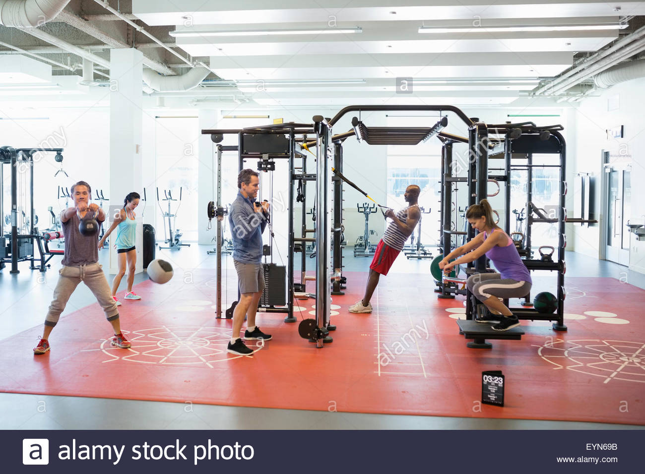 People exercising in gym Stock Photo - Alamy