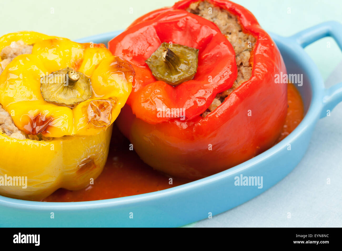 Stuffed red and yellow peppers Stock Photo - Alamy