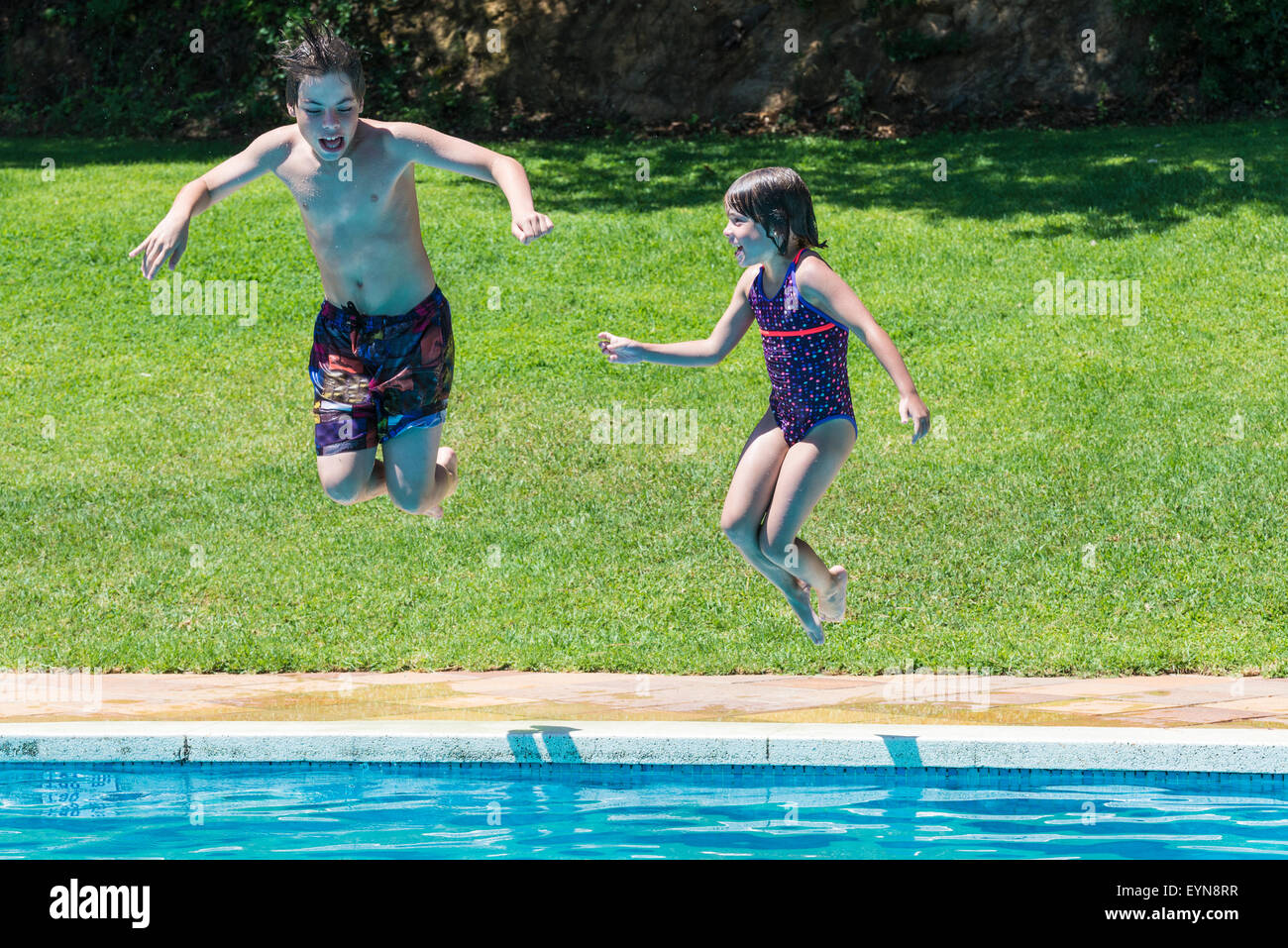 Family jumping into pool hi-res stock photography and images - Alamy