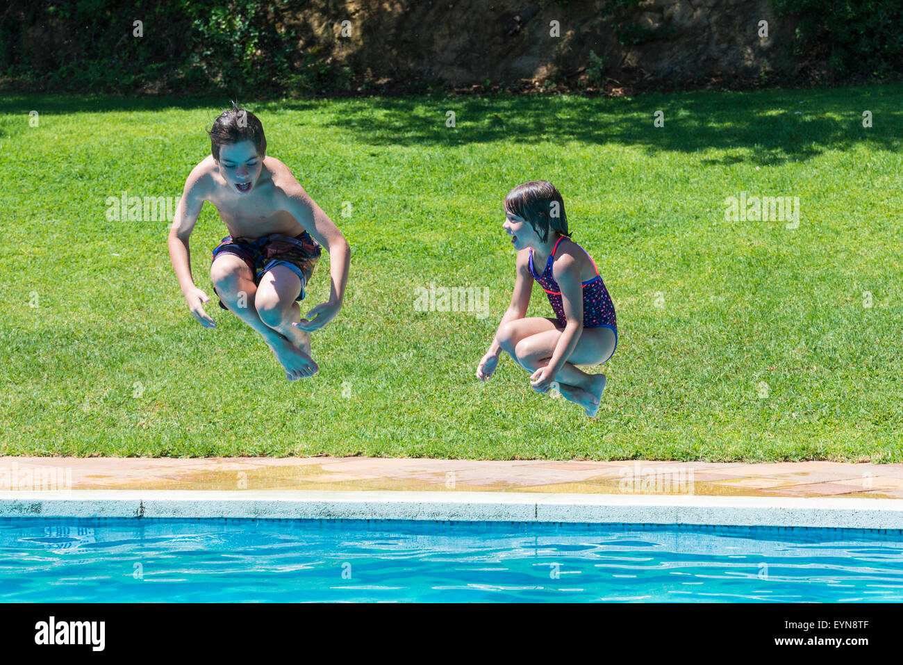 Family jumping into pool hi-res stock photography and images - Alamy