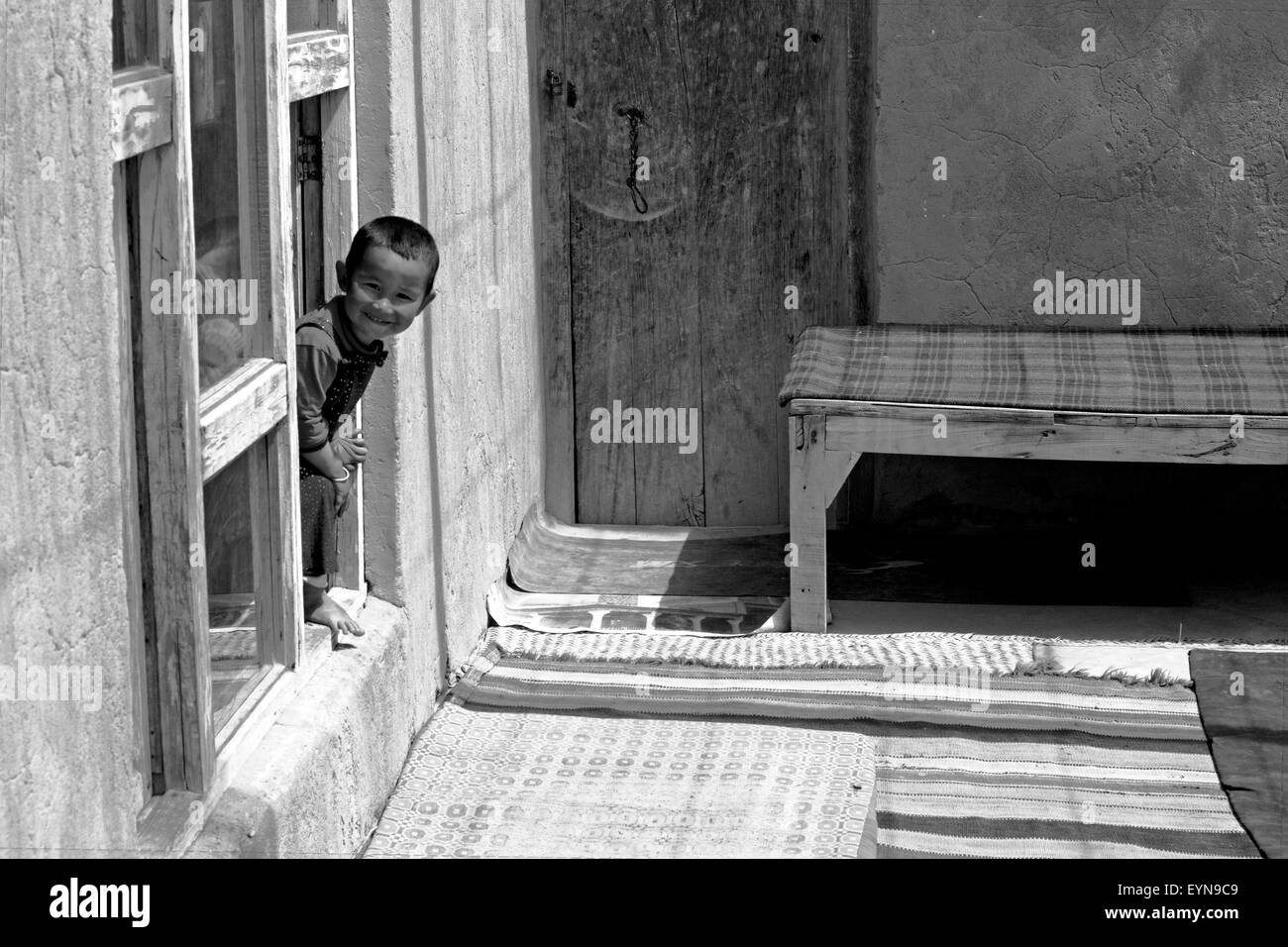 Boy peering hi-res stock photography and images - Alamy