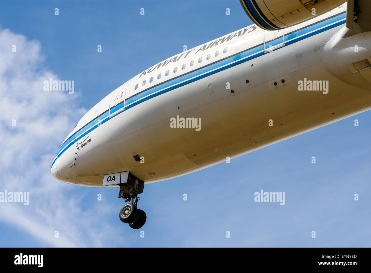 Kuwait Airways Boeing 777 aeroplane passes low overhead on approach to ...