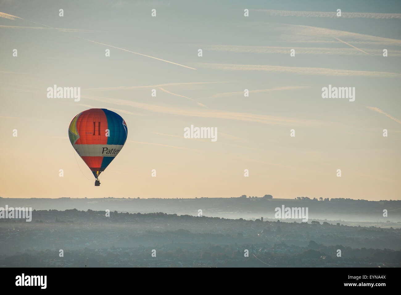 Hot air balloons fly over the city of Bristol in the early morning ...