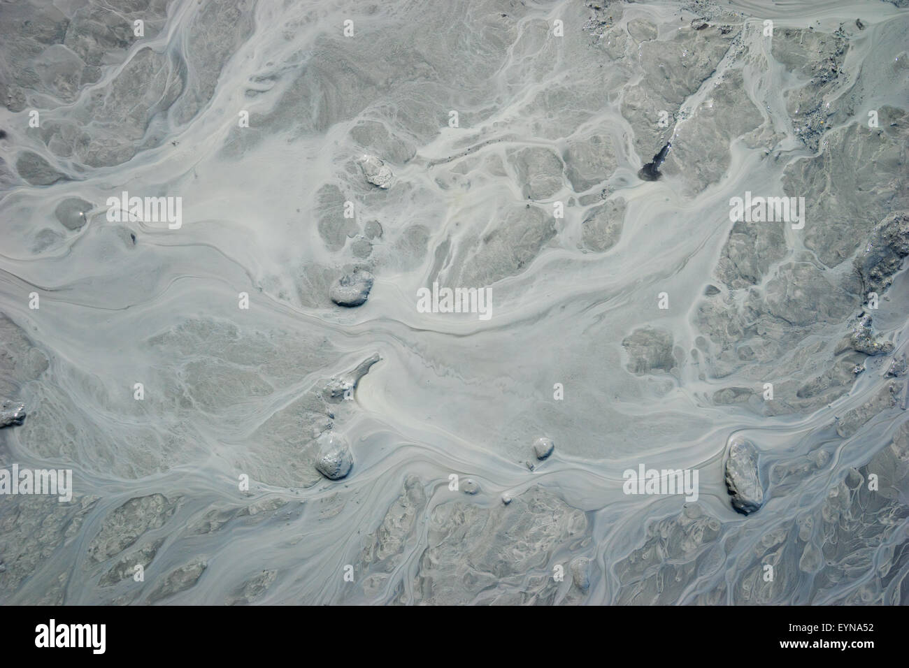 Flow of rocky silt stream in mud of Alaska Stock Photo - Alamy