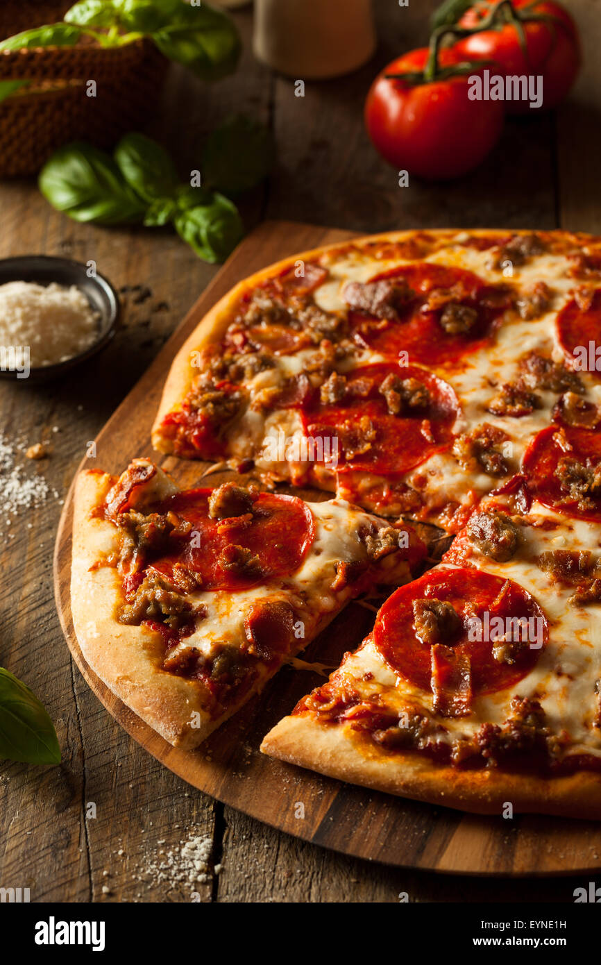 Homemade Meat Loves Pizza with Pepperoni Sausage and Bacon Stock Photo ...