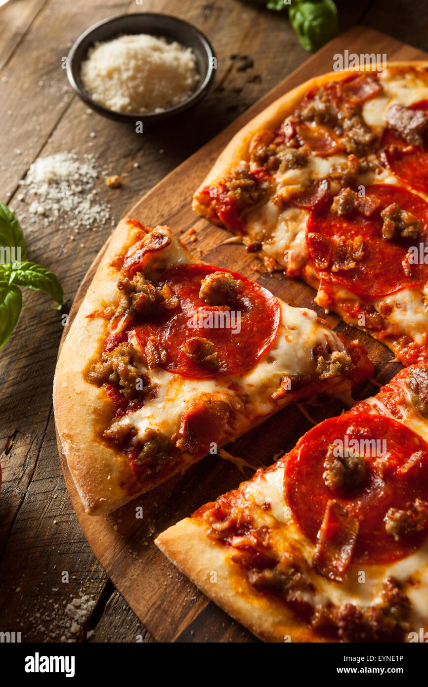 Homemade Meat Loves Pizza with Pepperoni Sausage and Bacon Stock Photo ...