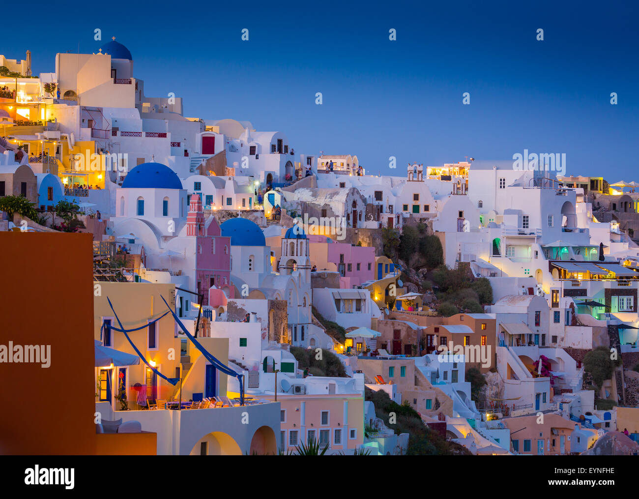 Iconic sunset in the town of Oia on the greek island Santorini (Thera ...