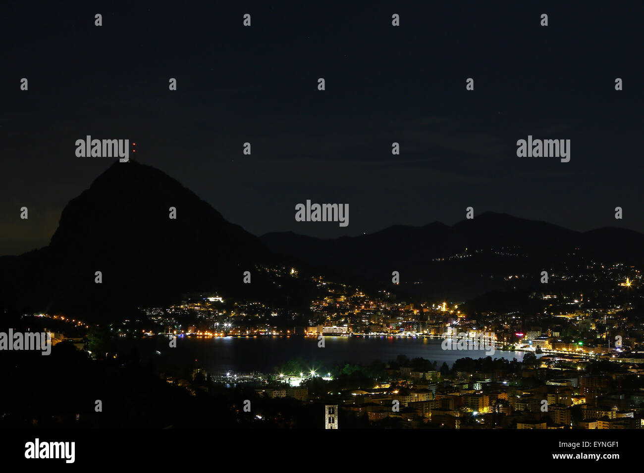 Lugano by night, city urban setting from the air outlining the Monte ...