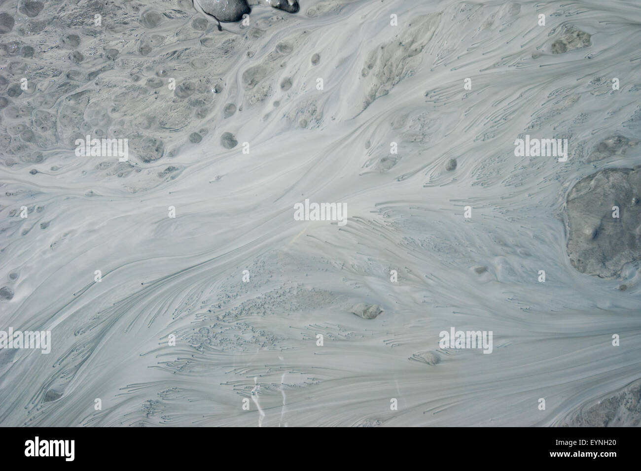 Mud and soil flow in stream leaving silt pattern Stock Photo - Alamy