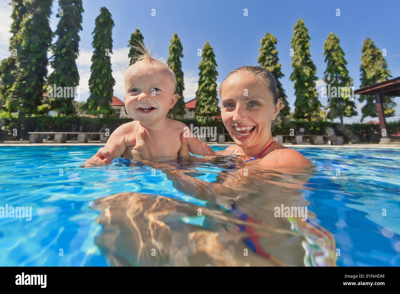 Woman diving pool villa hi-res stock photography and images - Alamy