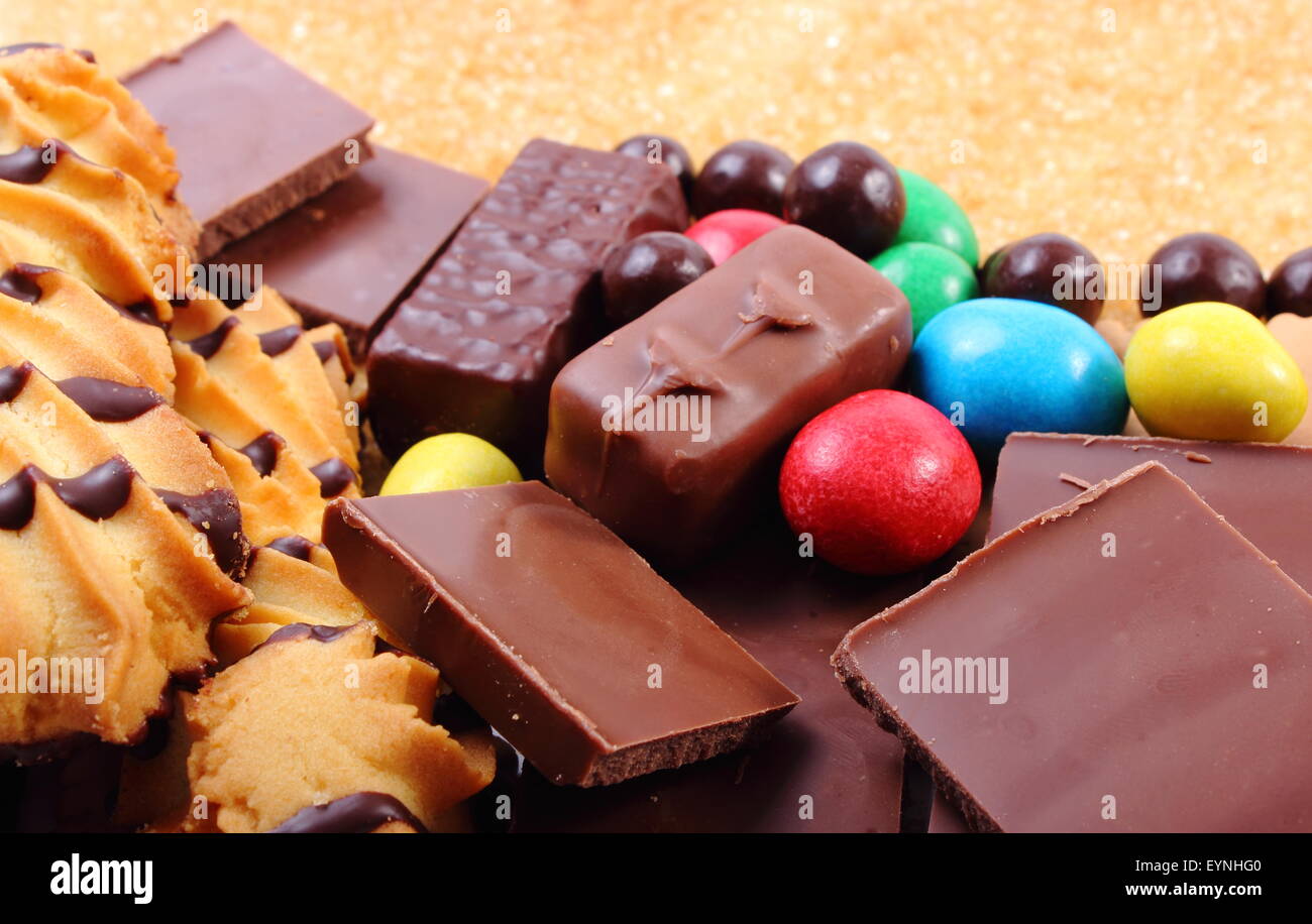 A lot of candies and cookies with brown cane sugar, too many sweets ...
