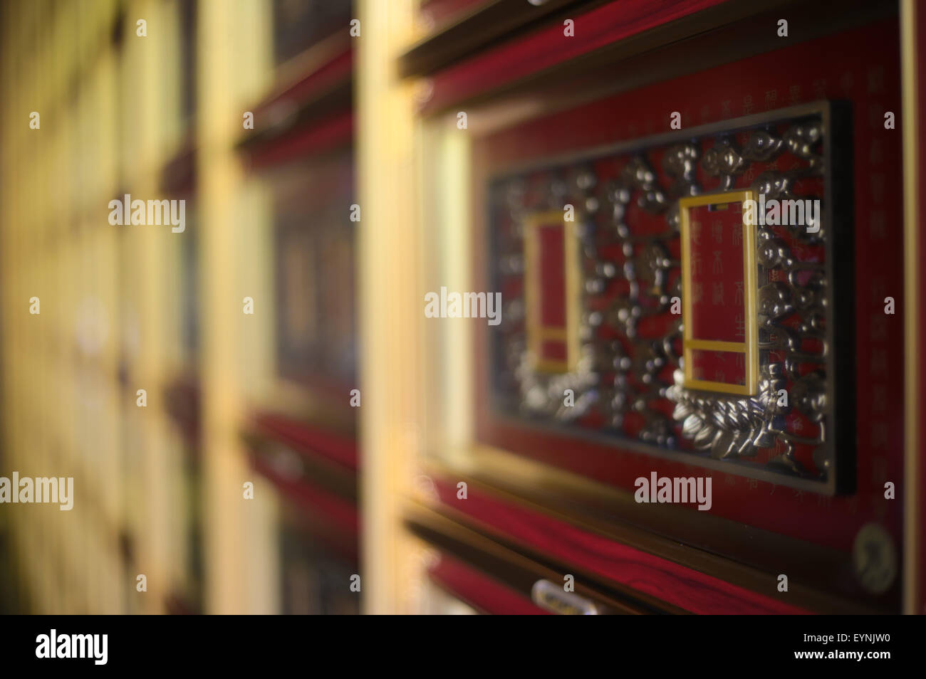 Rows of chinese memorial face plate Stock Photo - Alamy