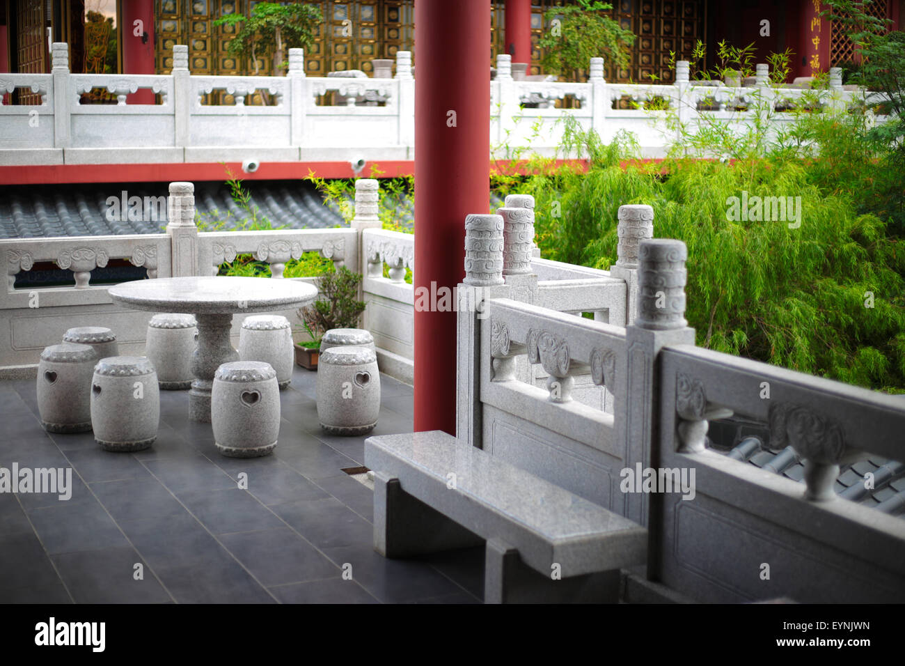 Table and chairs for resting at a chinese memorial park Stock Photo - Alamy