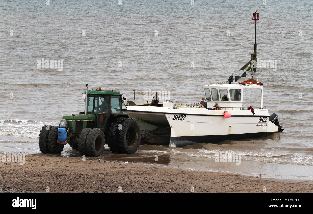Fishing boats landing on the beach at Hornsea, east Yorkshire, UK Stock ...