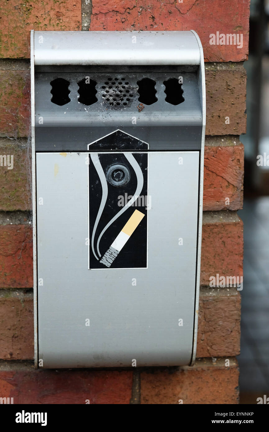 Waste box on public house outside wall for cigarettes Stock Photo - Alamy