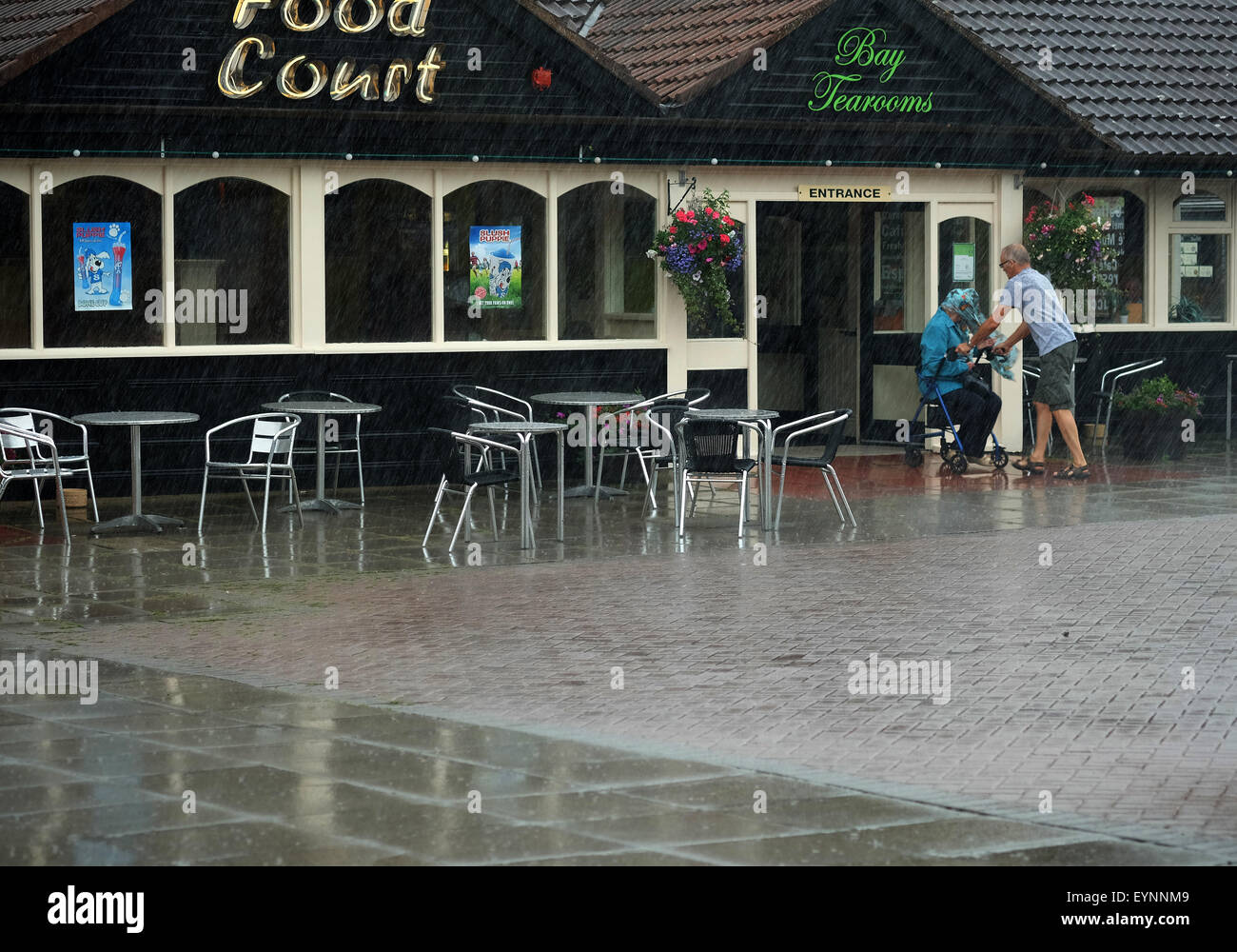 Heavy rain outside restaurant Stock Photo - Alamy