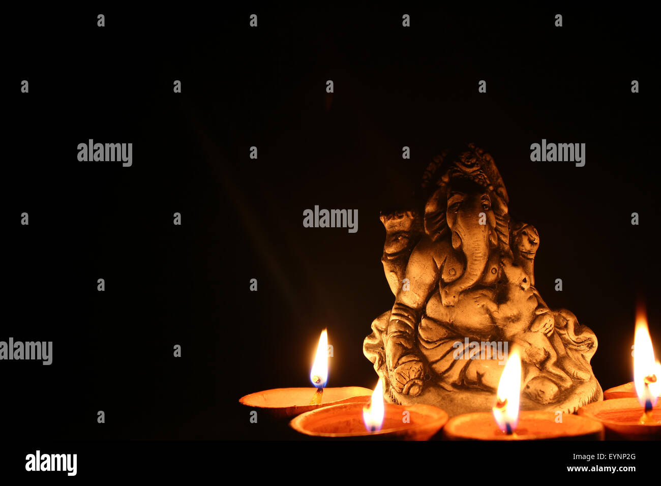 lord ganesha with beautiful diya at diwali Stock Photo - Alamy