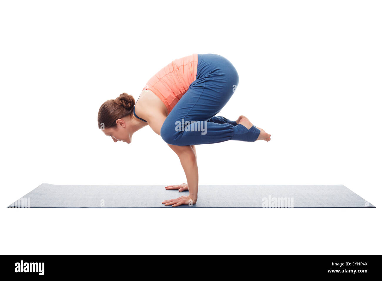 Beautiful sporty fit yogini woman practices yoga asana kakasana Stock ...