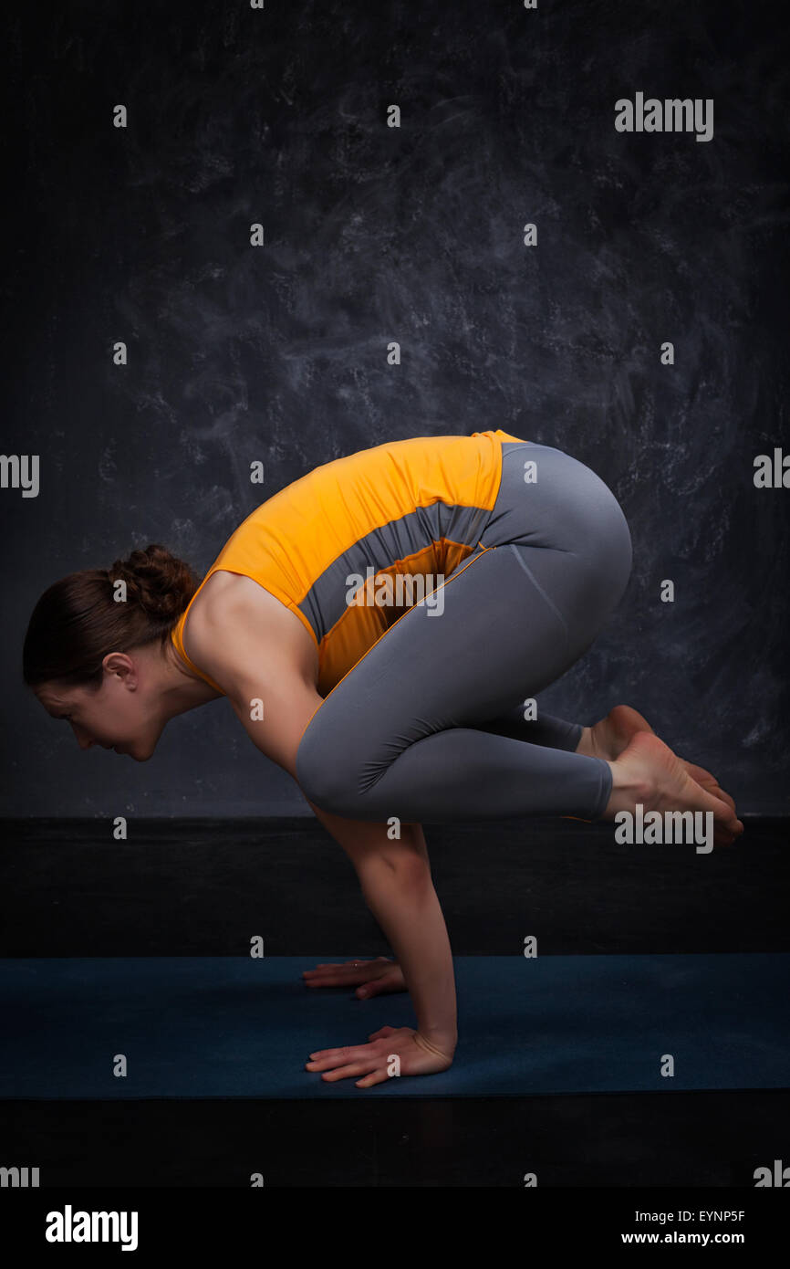 Beautiful sporty fit yogini woman practices yoga asana kakasana Stock ...