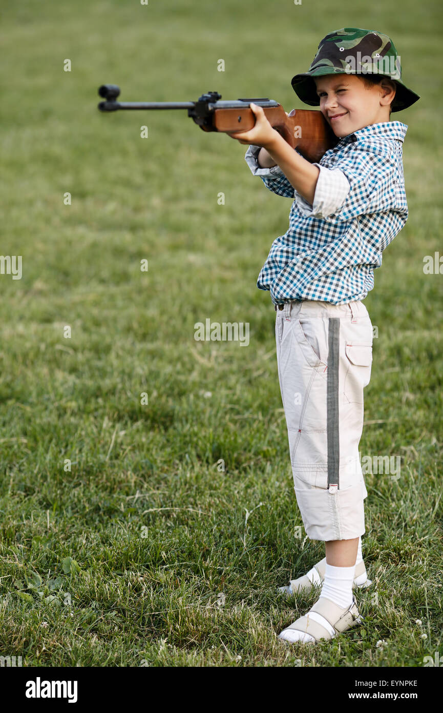 little boy with airgun outdoors Stock Photo - Alamy