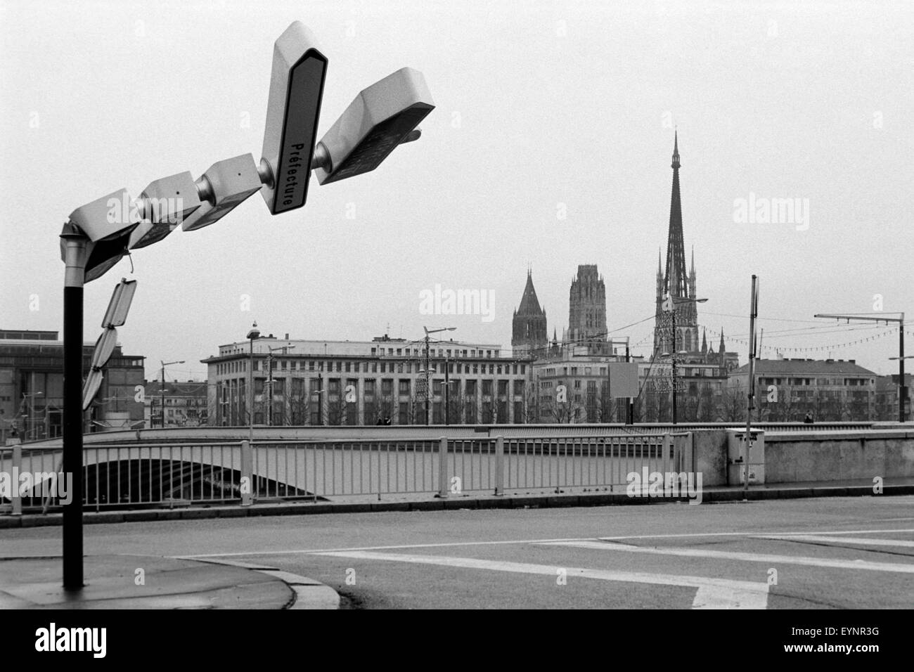 a bent over street sign amongst the damage caused by a mini tornado ...