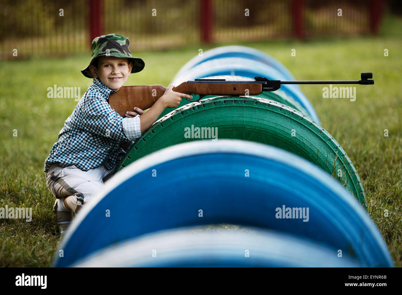 little boy with airgun outdoors Stock Photo - Alamy